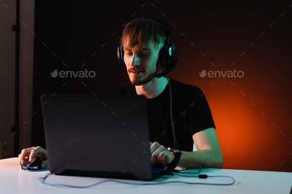 Gamer getting ready for an online gaming tour. Generation Z. Guy using ...