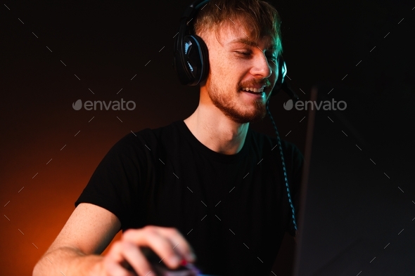 Gamer getting ready for an online gaming tour. Generation Z. Guy using ...