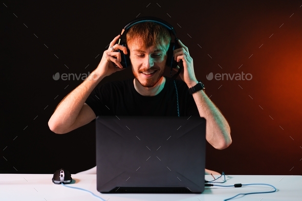 Gamer getting ready for an online gaming tour. Generation Z. Guy using ...