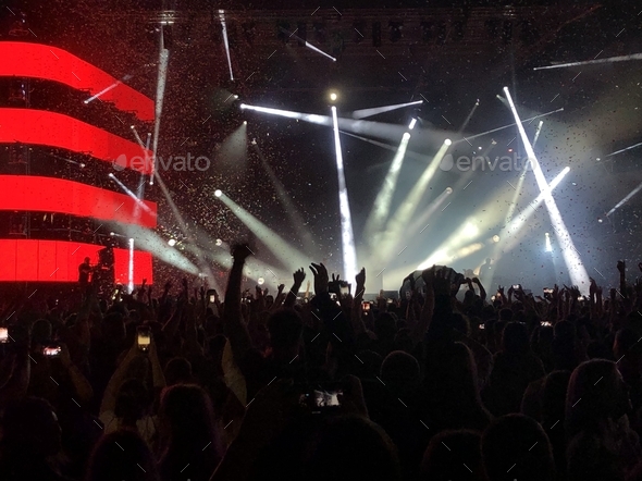 Night life euphoria, music, dance, outdoor concert, hands up, lights ...