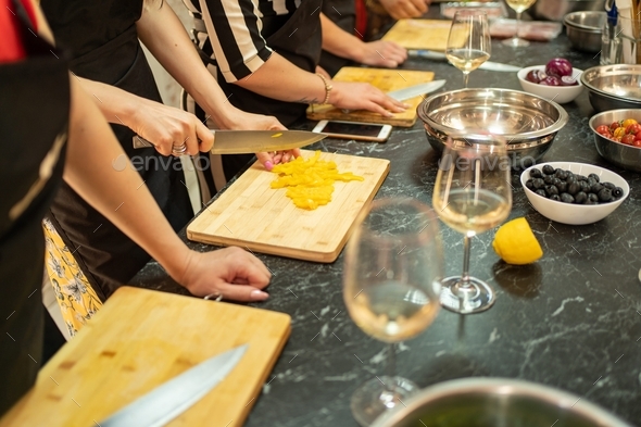 Cooking classes in the chefs kitchen. Many women cook together for a ...
