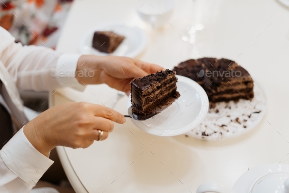 Woman serving cake at the table. Birthday celebrating at home Stock ...