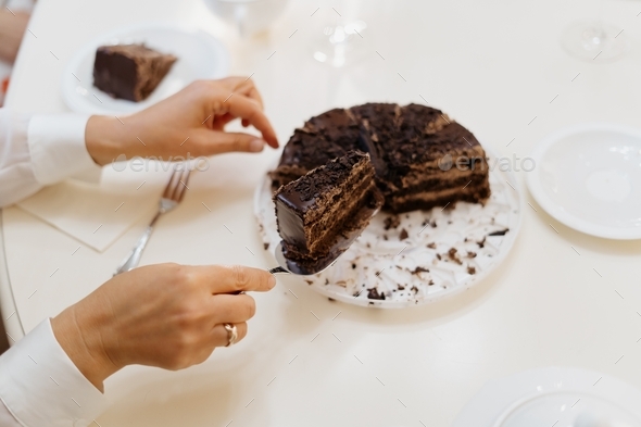 Woman serving cake at the table. Birthday celebrating at home Stock ...