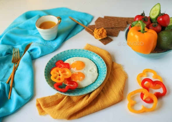 Colorful table for a healthy breakfast with eggs, fresh vegetables ...