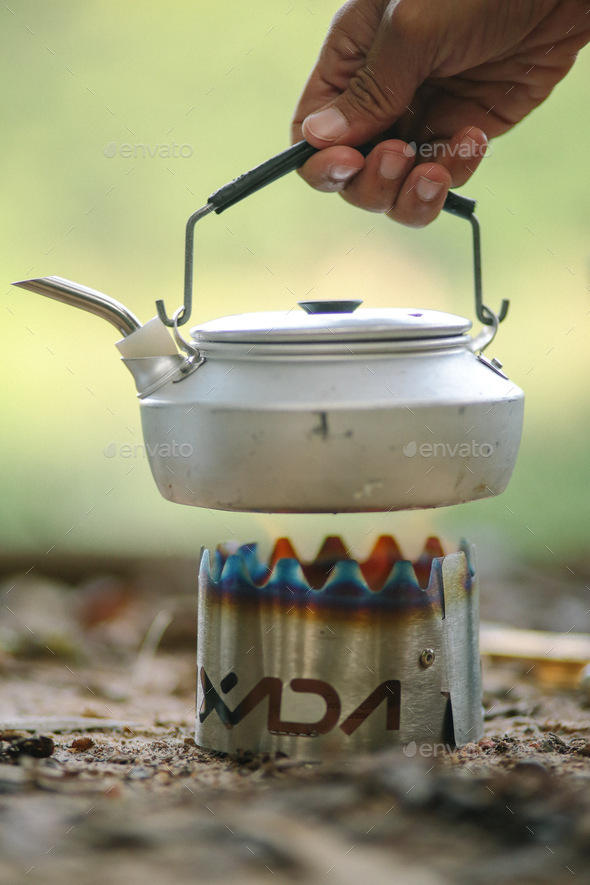 Kettle and alcohol stove burner Stock Photo by udeyismail | PhotoDune