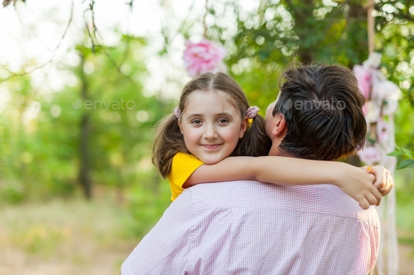 Smiling little girl hugging her father Stock Photo by InnaVlasova ...