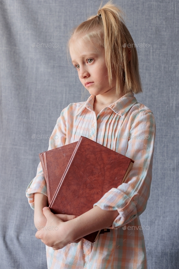 Portrait of a child with books. Reading books. Stock Photo by ...