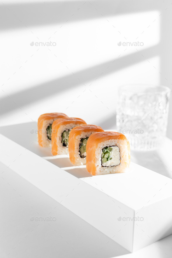 Traditional Japanese food sushi on a white cube, minimalism Stock Photo ...