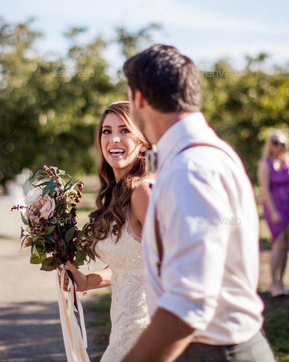Bride and Groom happily walking down the isle after wedding ceremony ...