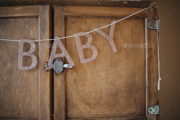 Letters hang in a string spelling baby at a baby shower Stock Photo by ...