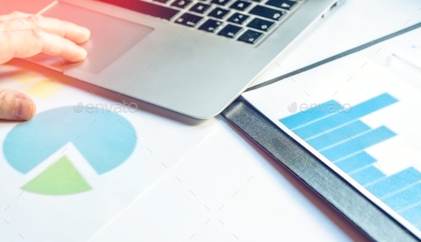 Office desk with charts and computer Stock Photo by LittleIvan | PhotoDune