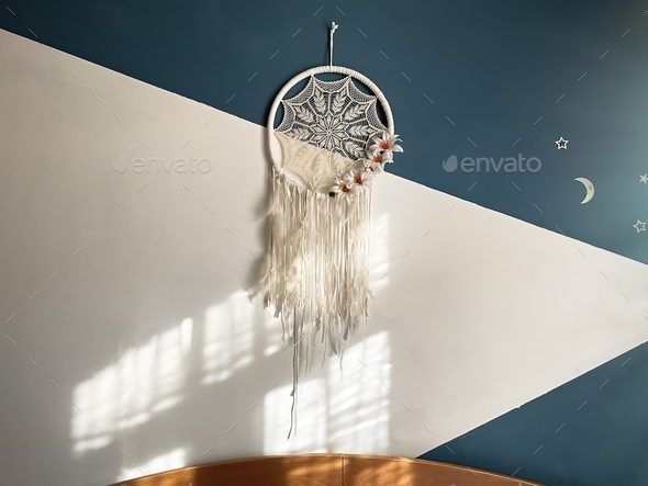 Dreamcatcher on wall over bed, decorated bed room with Native American ...