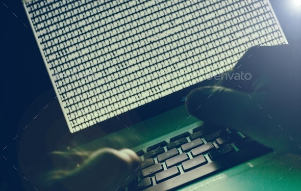 Hacker looking at binary code Stock Photo by LittleIvan | PhotoDune