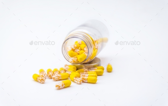 Open Container with Vitamin D3 Multivitamin capsules on white ...