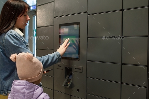 Receiving an order from a self-service parcel machine. Online shopping ...