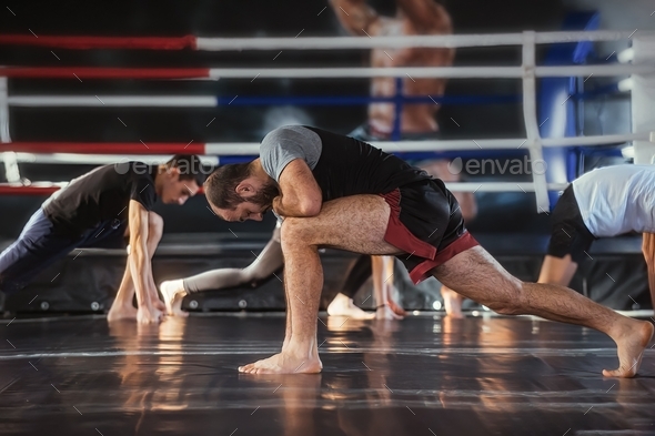 Boxer trainer conducts training for teenagers in the gym Stock Photo by ...