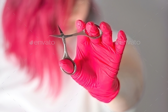 Manicure and pedicure master shows tools for work Stock Photo by olgar23