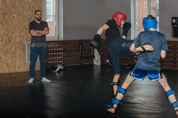 Boxing teen athletes training with experienced mentors Stock Photo by ...