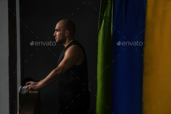 male athlete boxer looks tiredly out the window after the fight Stock ...