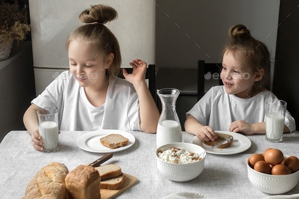children have breakfast at home Stock Photo by olgar23 | PhotoDune