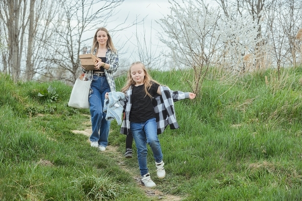 Happy active family goes on a picnic in the warm season, early spring ...