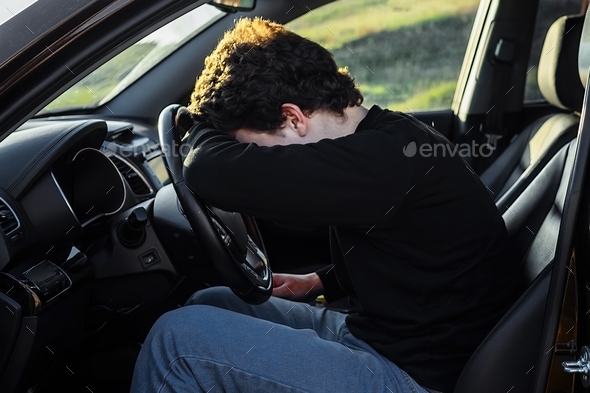 frustration and stress in young drivers behind the wheel of a car Stock ...