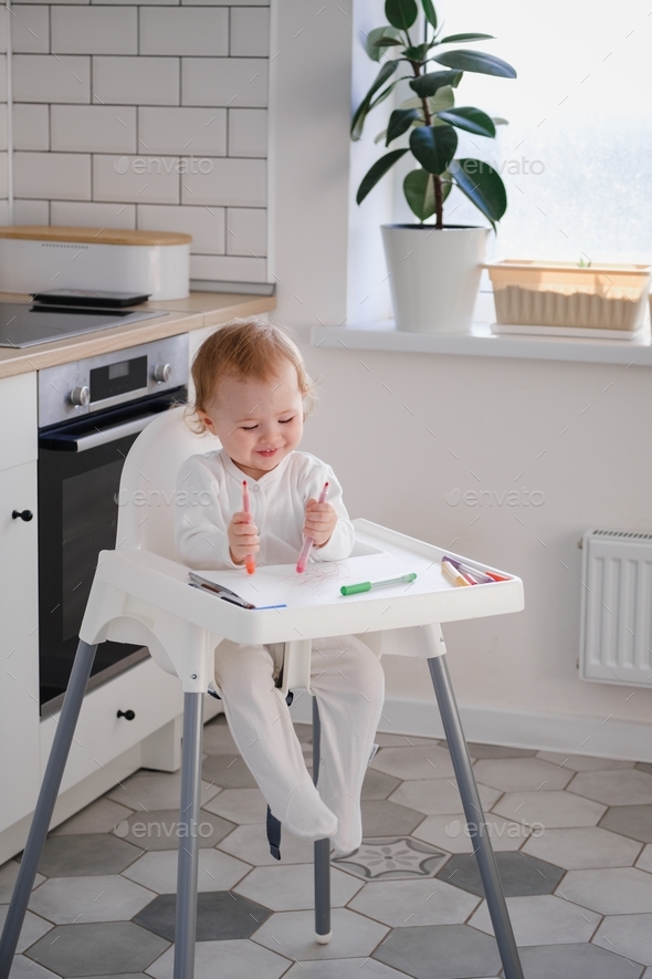 A laughing baby drawing by both hands first picture using colored ...