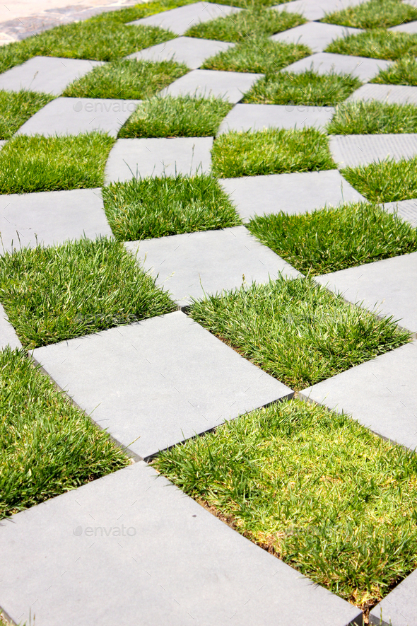 Natural and manufactured checkerboard of grass and concrete Stock Photo ...