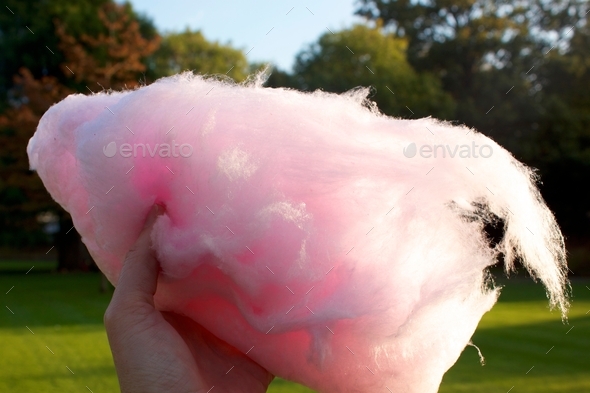 Woman’s hand holding pink cotton candy Stock Photo by reinasmyth ...