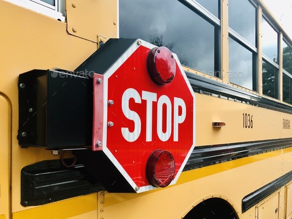 Red Stop sign on yellow school bus Stock Photo by reinasmyth | PhotoDune