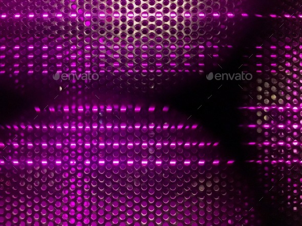 Pink lights shining through black metal Stock Photo by reinasmyth