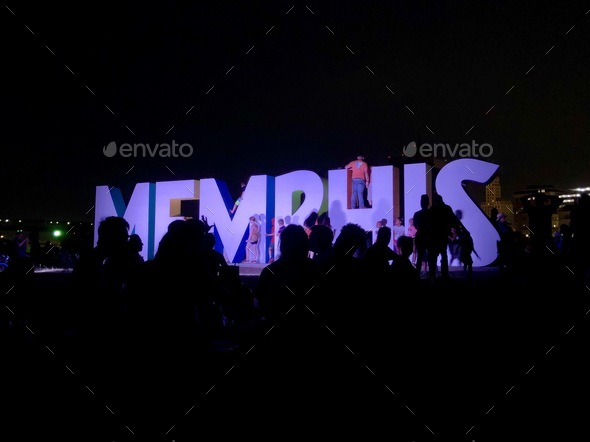 Memphis sign with silhouettes of people posing Stock Photo by reinasmyth