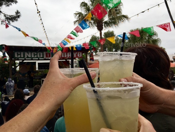 Hands cheersing with margaritas Cinco de mayo celebration with ...