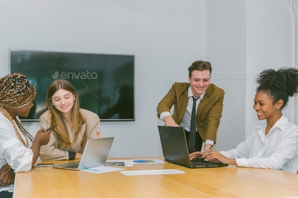 Coworkers cooperating and working together at office meeting, teamwork ...