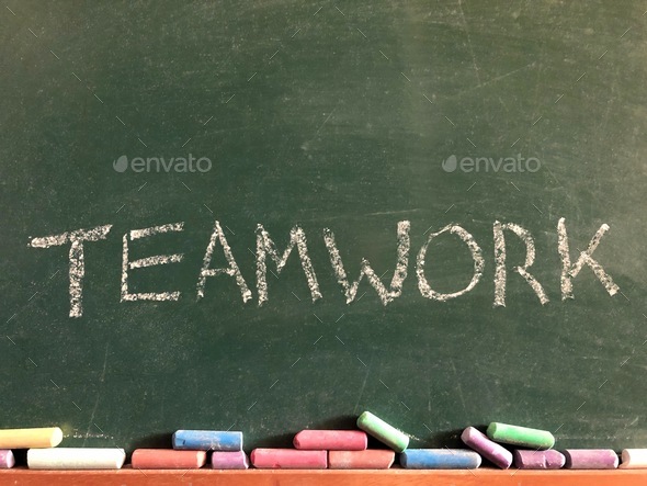 The word Teamwork written in chalk on a chalkboard. Creative business ...