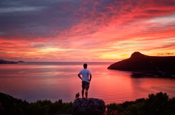 Man at sunrise looking at the ocean Stock Photo by crew_street | PhotoDune