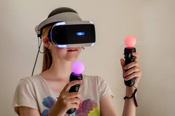 Teenage girl wearing VR headset. virtual reality technology. Gaming ...