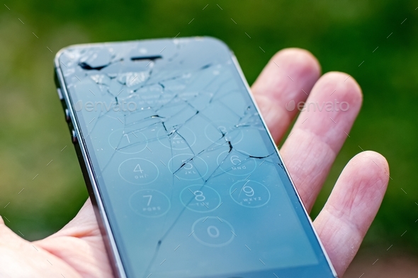 Broken mobile phone with smashed screen Stock Photo by Daria_Nipot
