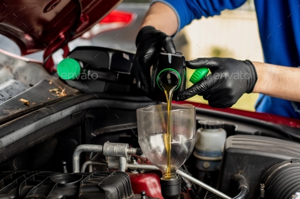 Do it yourself car oil replacement change. Garage mechanics. At home ...