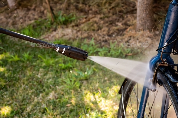 Cleaning washing bicycle wheel with high pressure washer cleaner Stock ...