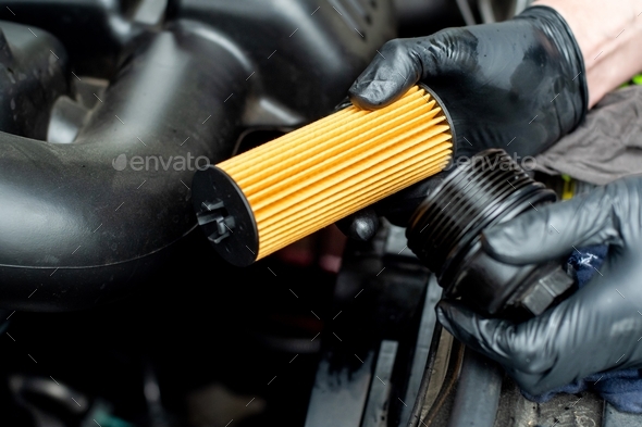 Changing car oil filter. DIY. At home vehicle maintenance Stock Photo ...