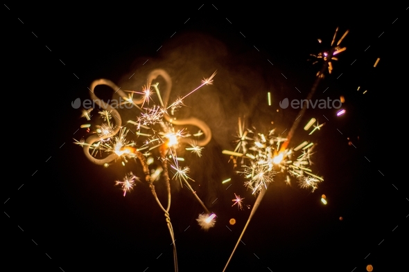 Sparklers in the dark. New yeas celebration Stock Photo by Daria_Nipot