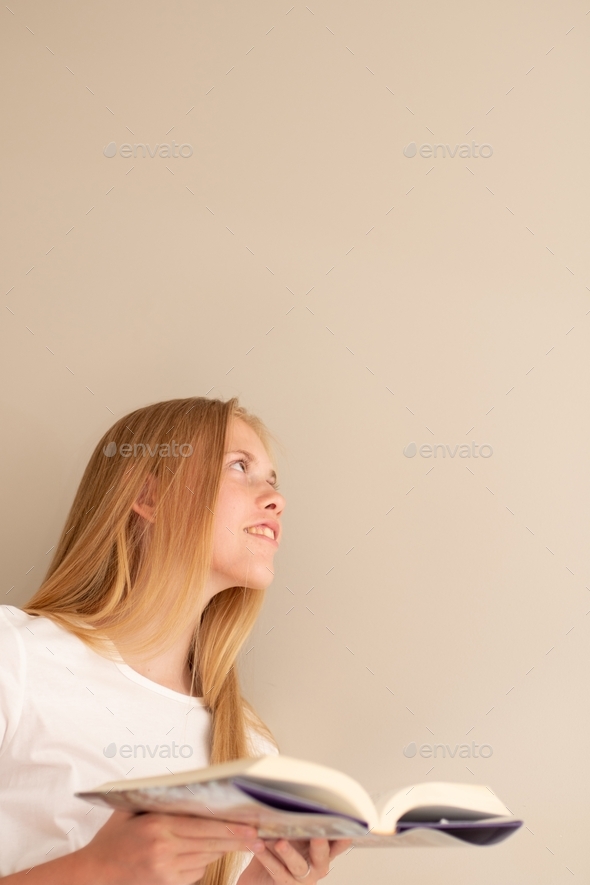 Teenage girl reading book vertical shot with copy space Stock Photo by ...