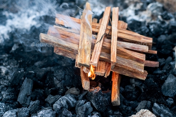 Starting the camp fire with kindling. Camping life. Stock Photo by ...