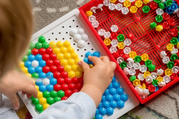 Toddler child early development. Mosaic pegboard game Stock Photo by ...