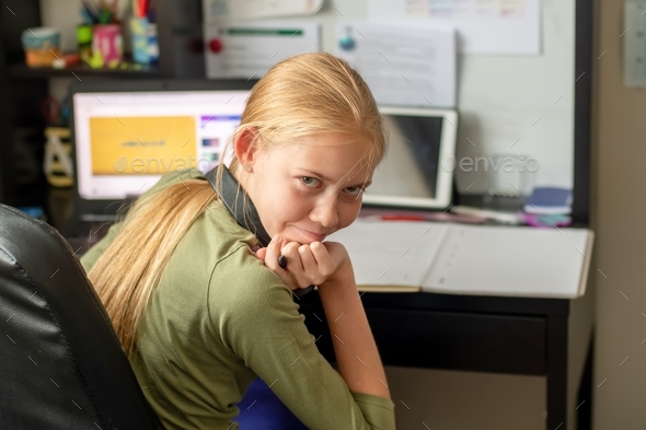 Teenage girl high school student doing homework at home. Distance ...