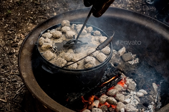 Cooking in cast iron camp oven with charcoal bbq beads. Camp cooking ...