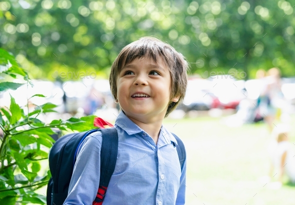 Cute little boy back to school, Kid carry backpack walking to school ...