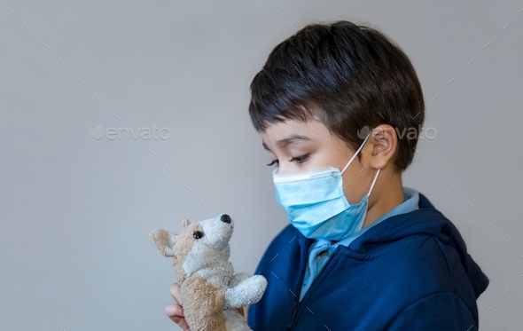 Sick child wearing a protective mask,ill kid in medical face mask with ...