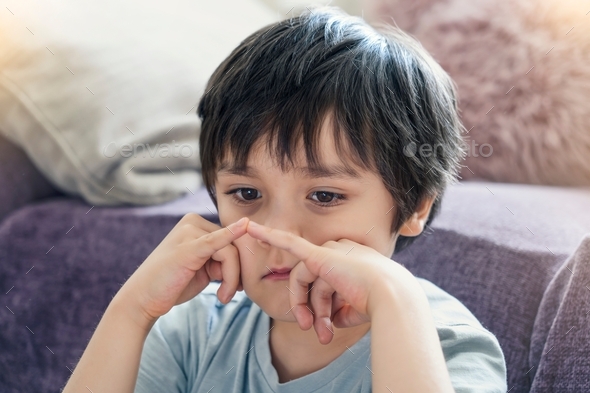 Lonely kid sad face sitting on floor, child sitting alone in living ...